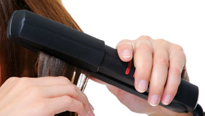 How to Use a Straightening Iron Without Damaging Hair